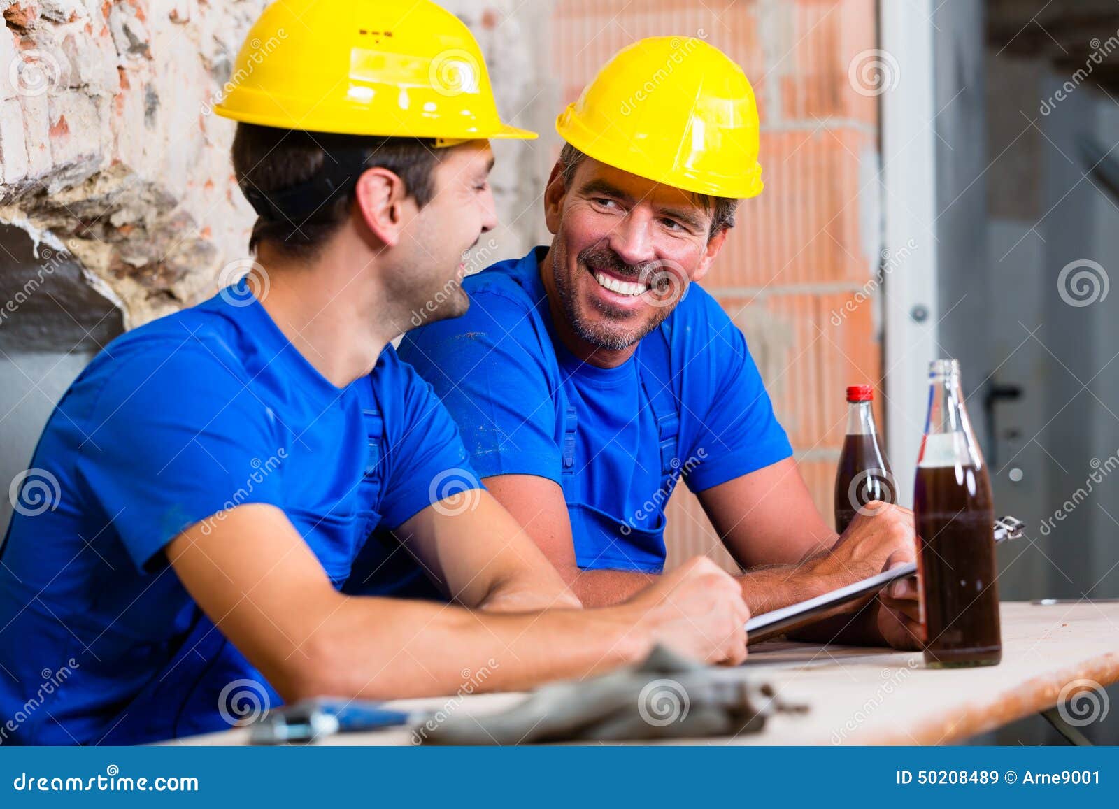 Builders Having Break on Construction Site Stock Image - Image of break ...