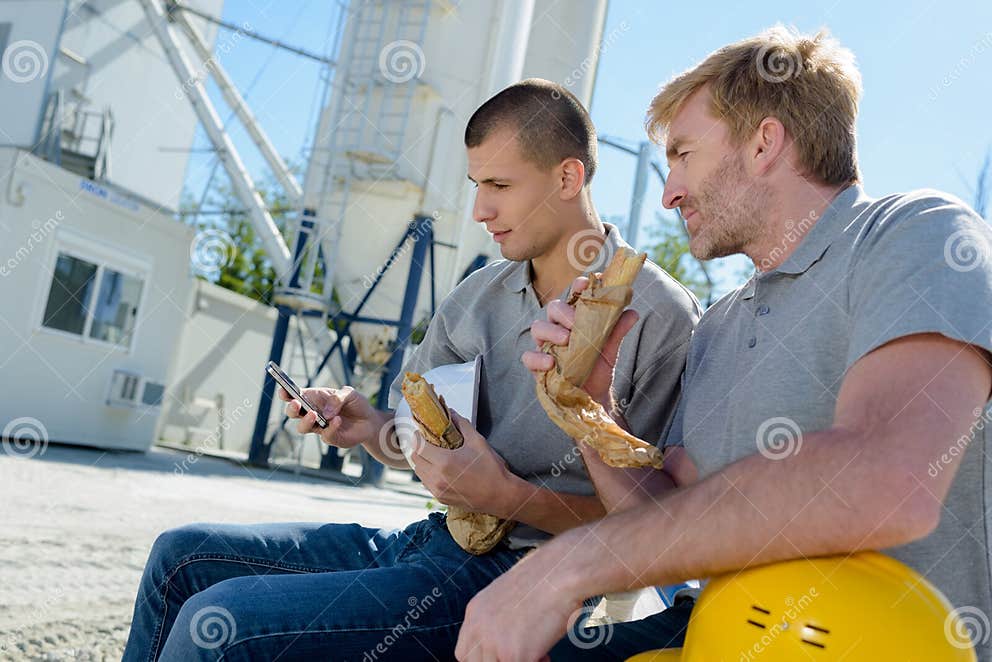 Builders Having Lunch Break Stock Image - Image of industry, engineer ...