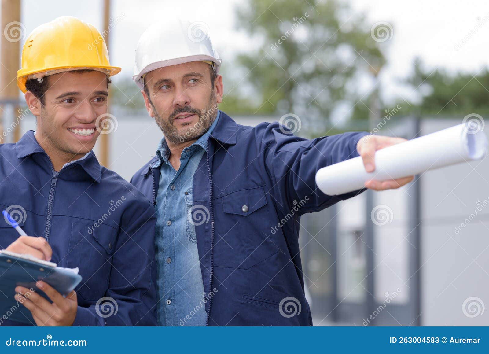 Builders in Helmets Pointing Outdoors Stock Image - Image of profession ...