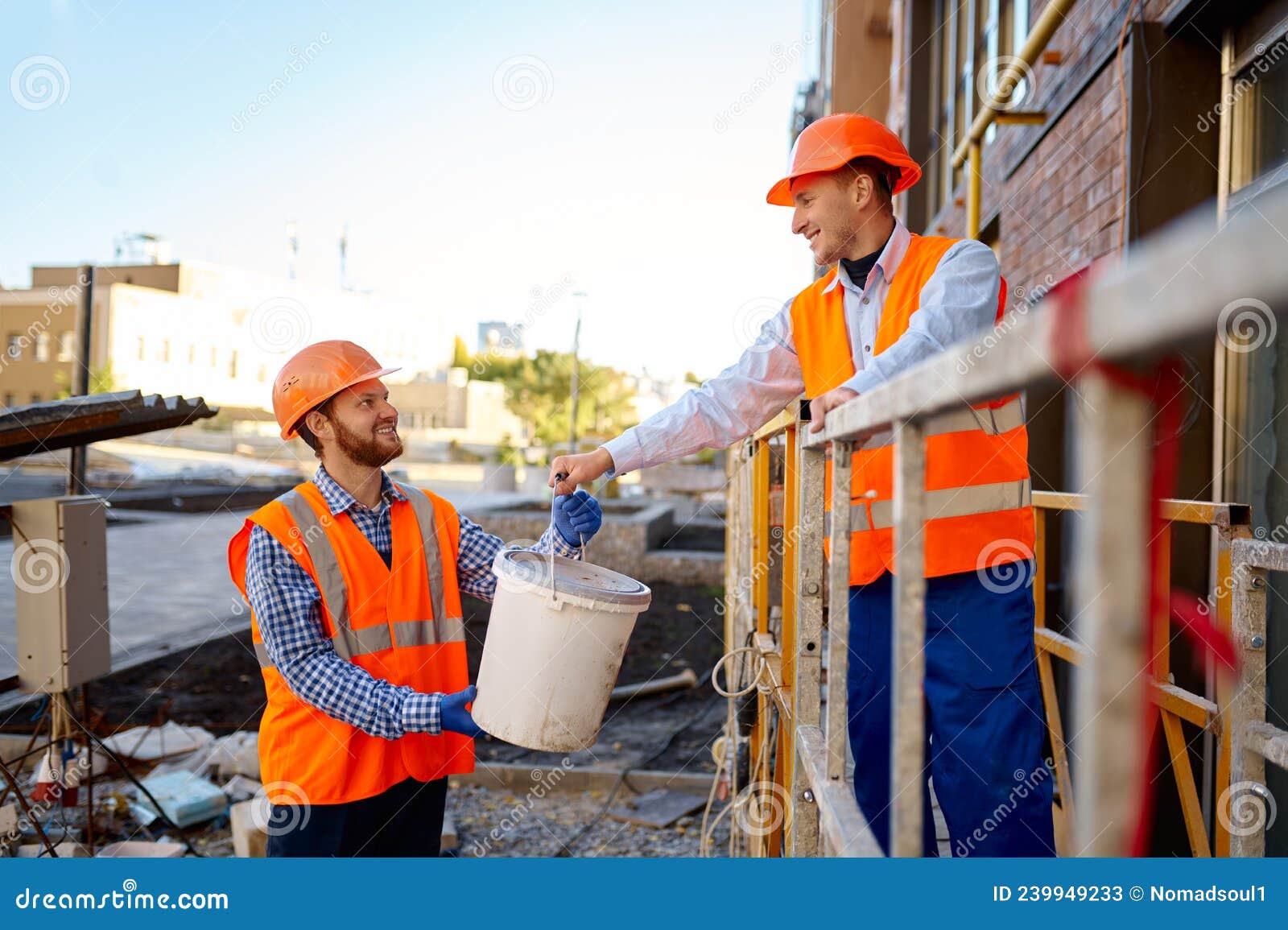 Builders Help Each Other at Construction Site Stock Image - Image of ...