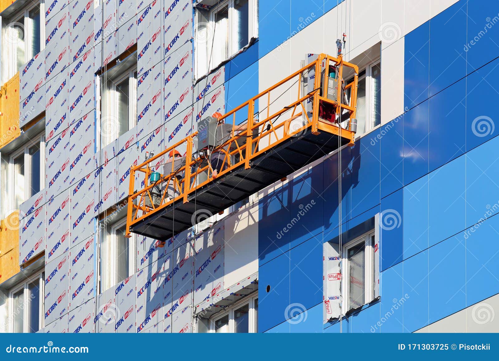 Builders Install Panels on the Facade of a Multi-storey Building ...