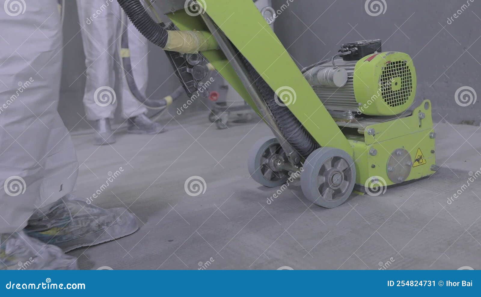 Builder Works Concrete Floor with Special Equipment. Concrete Floor ...