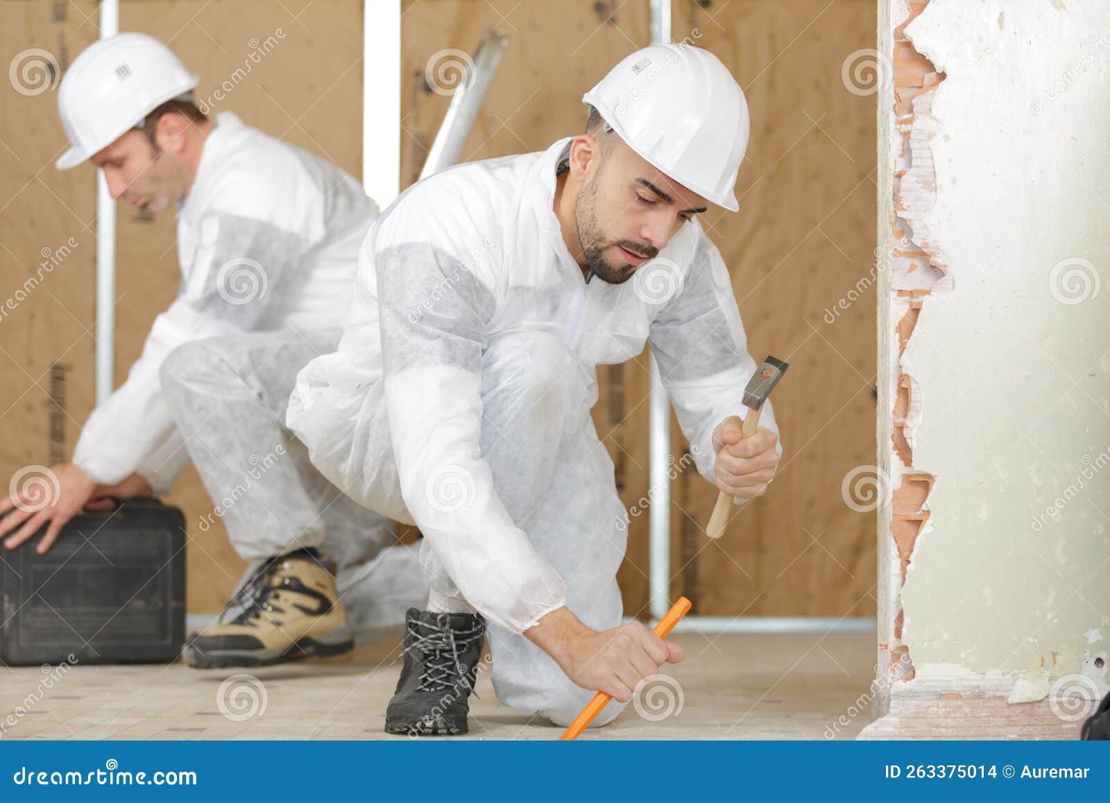 Builders Removing Old Floor Tiles Using Hammer and Chisel Stock Photo ...