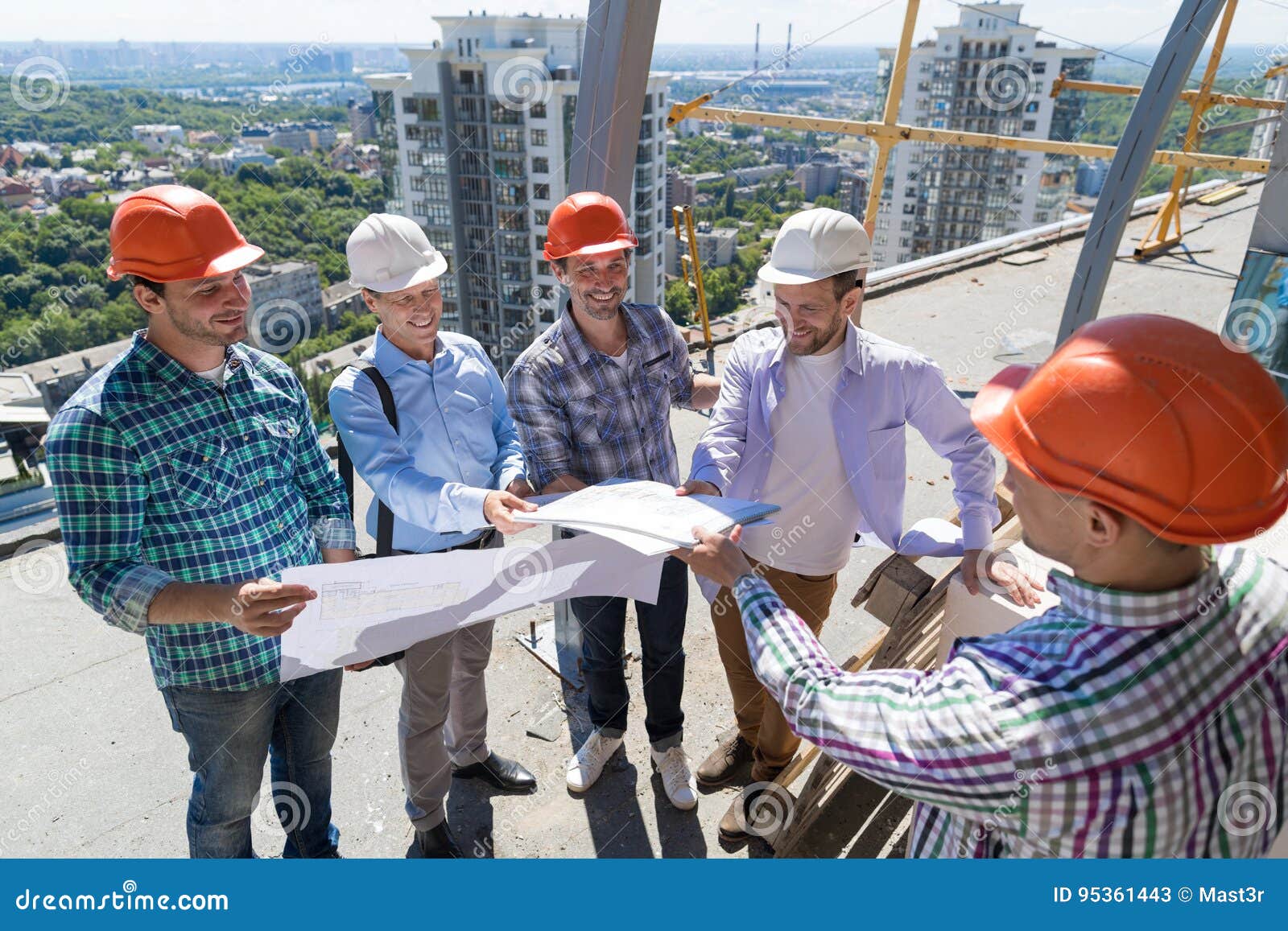 Builders on Site Looking on PLan Blueprint Contractor Explaining ...