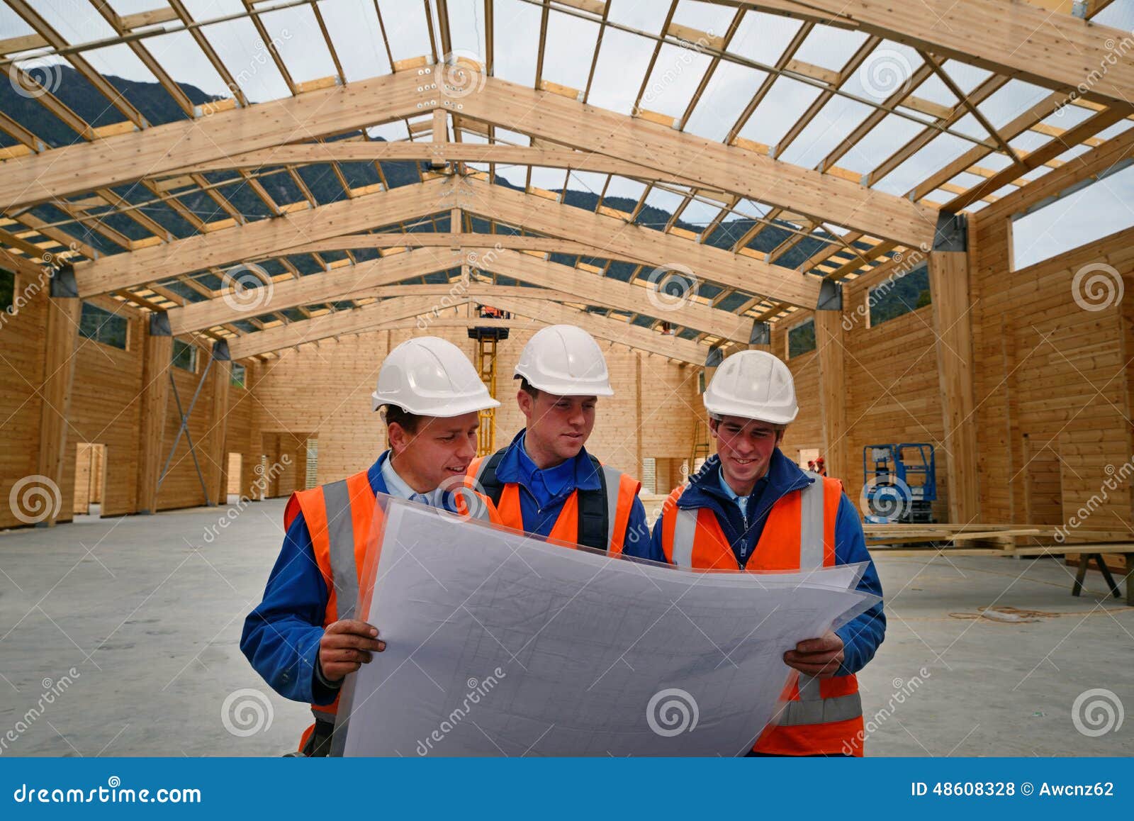 Builders study the plan stock photo. Image of people - 48608328
