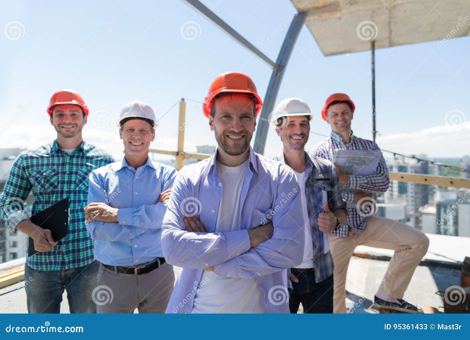 Builders Team Leader Over Group of Apprentices at Construction Site ... Builders Team Leader Over Group of Apprentices at Construction Site ...
