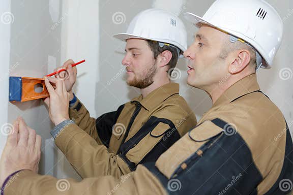 Builders Using Necessary Tool for Work Stock Photo - Image of ...
