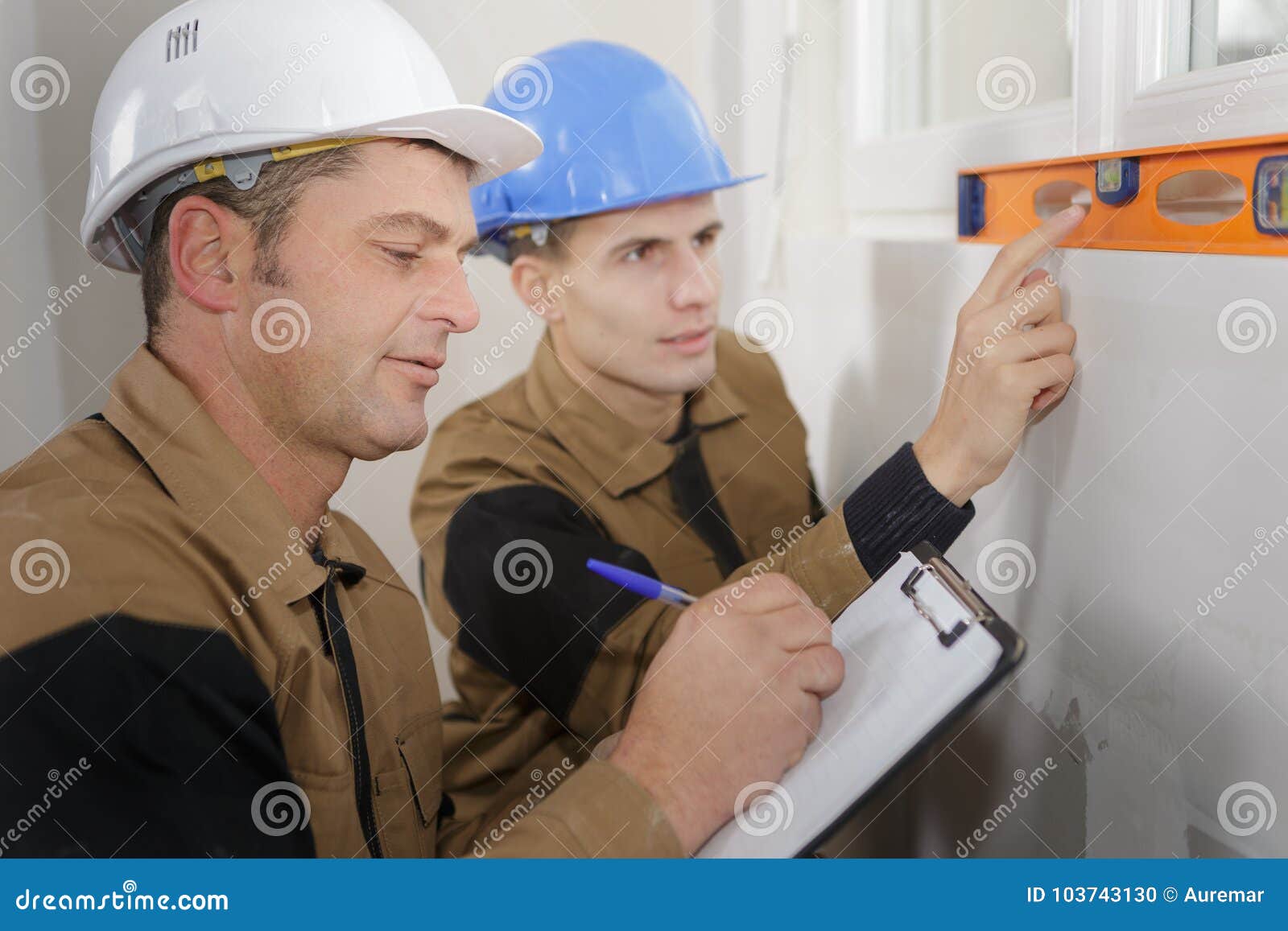 Builders Using Straight Edge To Check Levelness Stock Photo - Image of ...