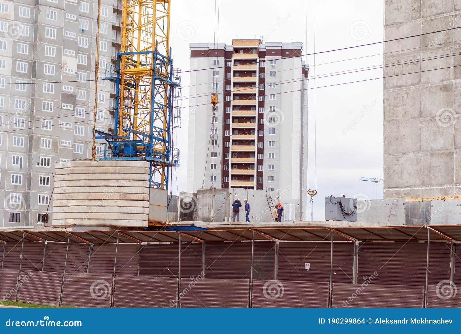 Builders Work On Monolithic Works At The Construction Site Of A Multi ...