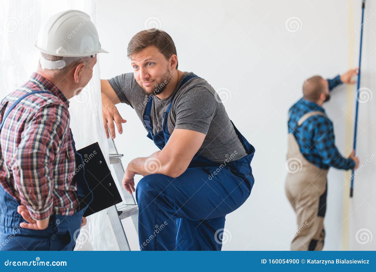 Builders at work stock photo. Image of blueprint, constructor - 160054900
