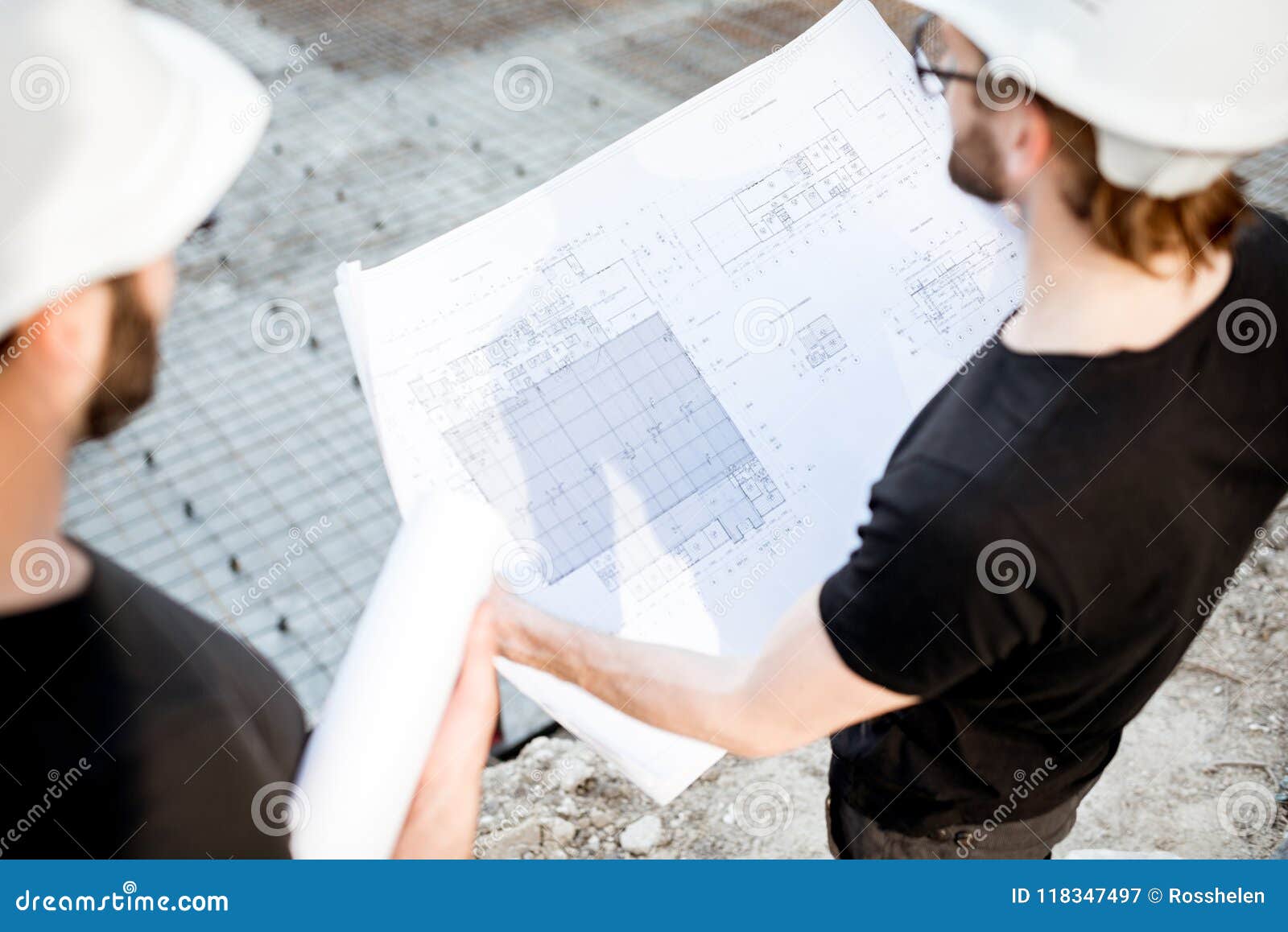 Builders Working with Architectural Drawings Stock Image - Image of ...