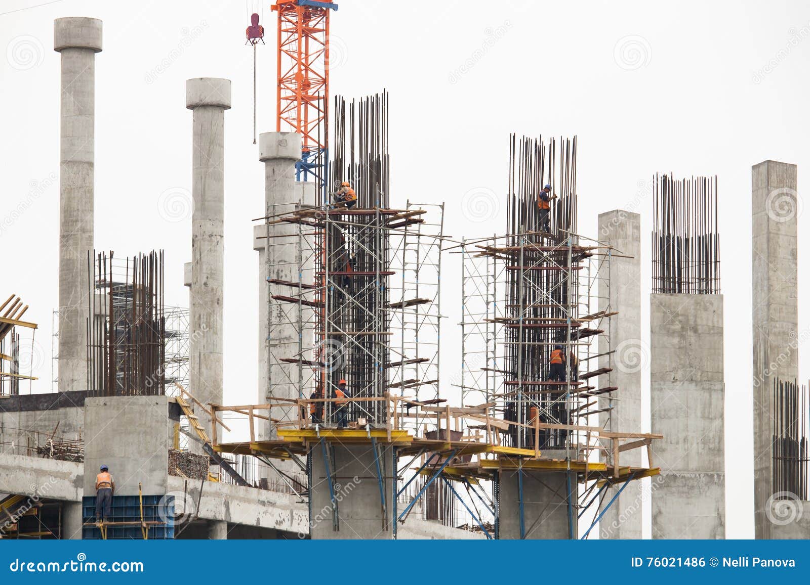 Builders Working on the Construction of a Large Building Stock Photo ...