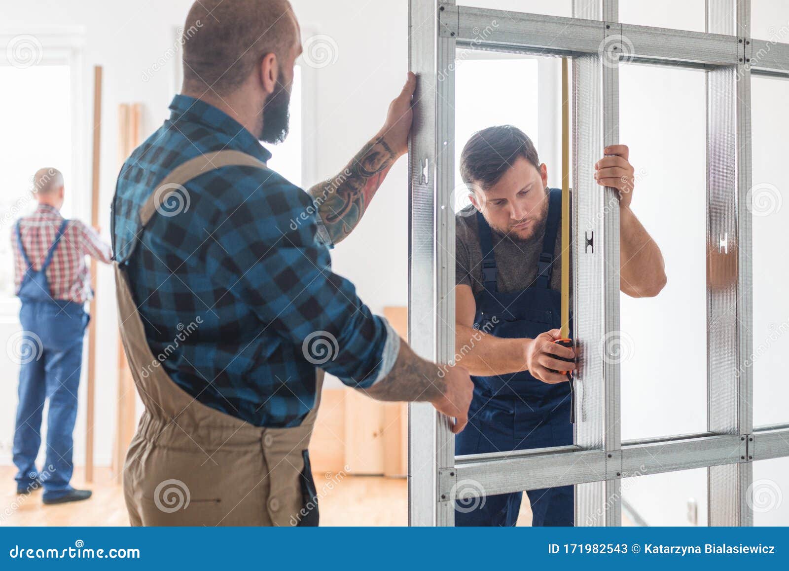 Builders working together stock image. Image of business - 171982543