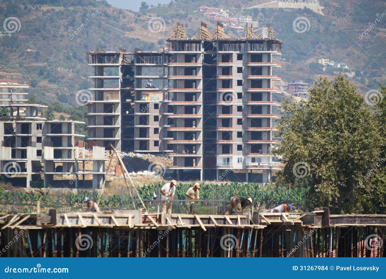Builders are Working on the Top Floor of a Building Stock Photo - Image ...