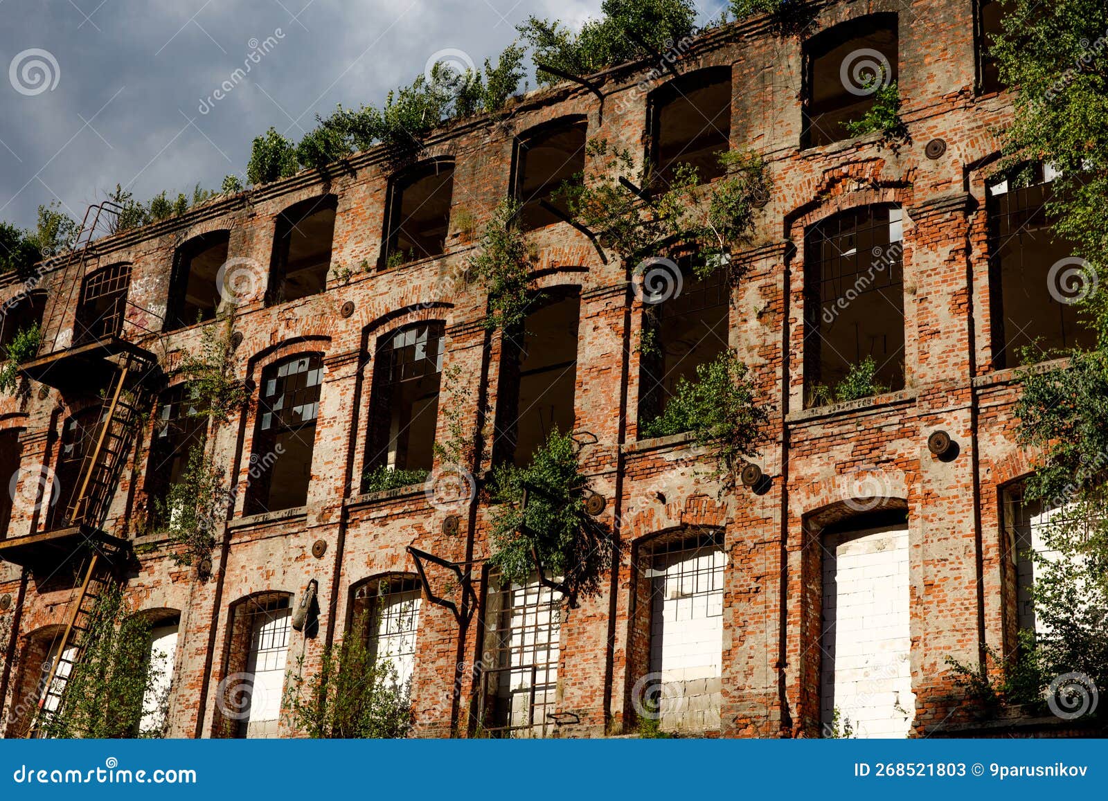 The Building of an Abandoned Factory, Red Brick and Broken Glass in the ...