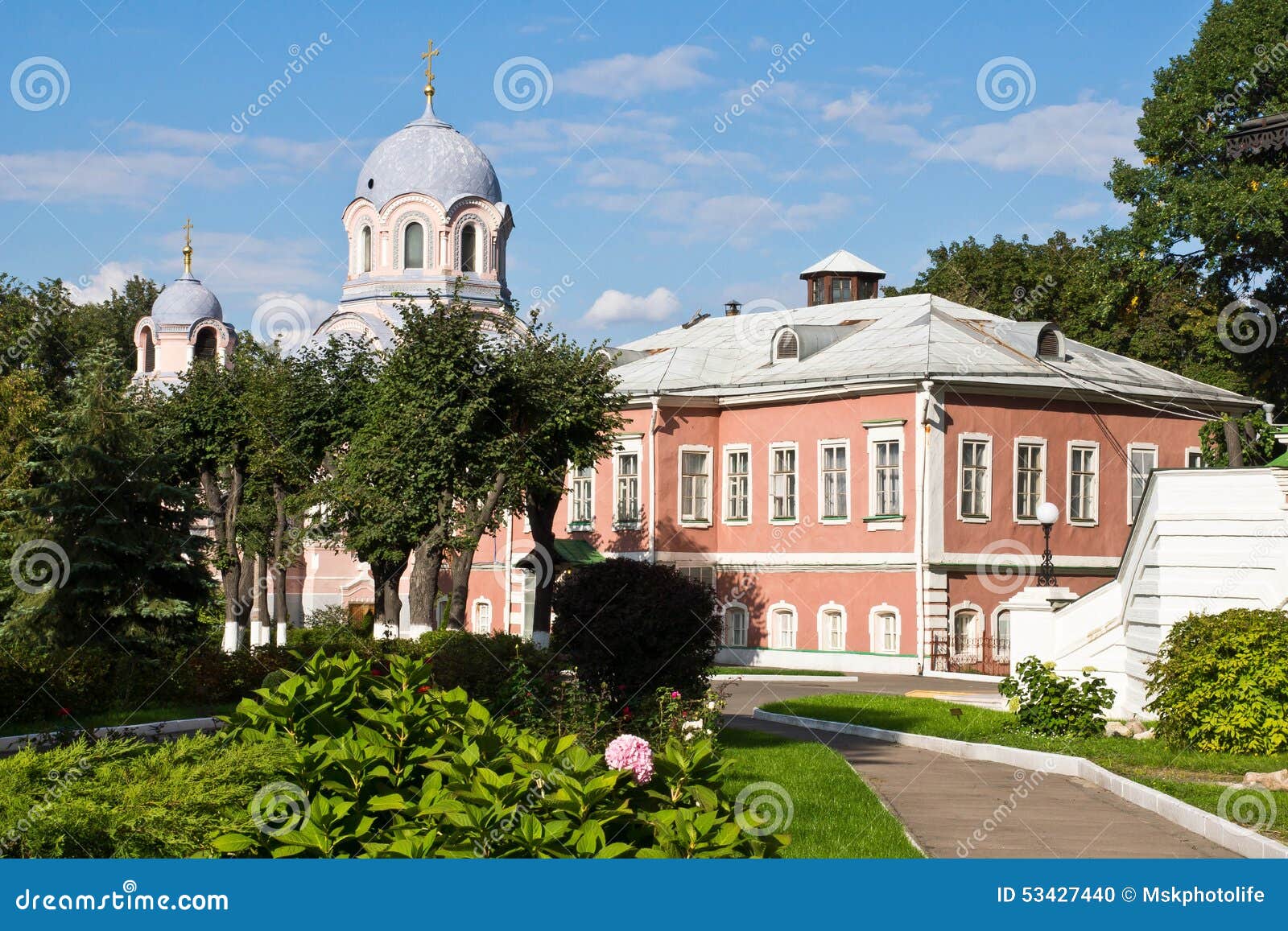 Building of Ancient Monastery Near Beautiful Flowerbed Stock Photo ...