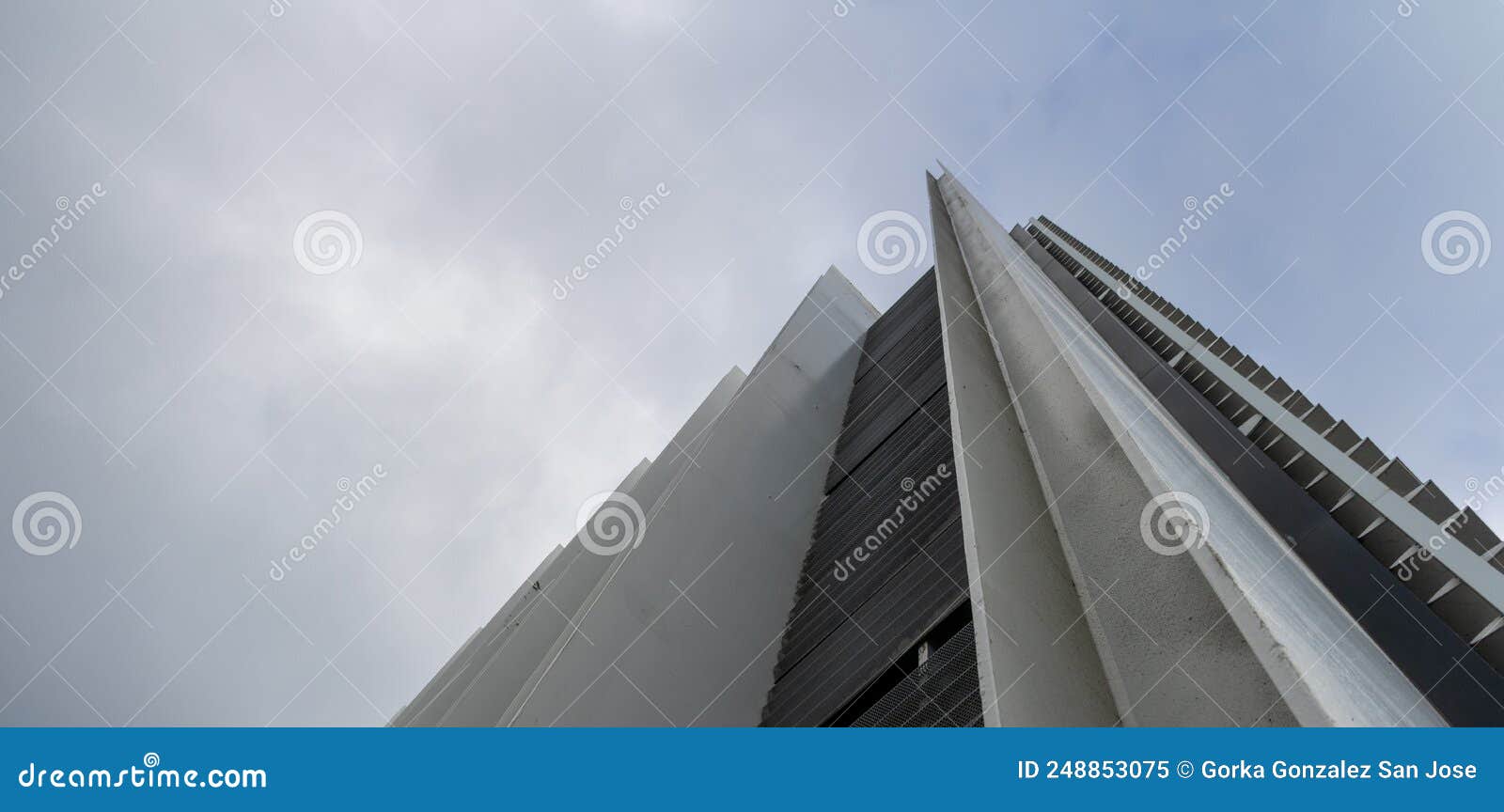 Building Architecture with Vertical Lines with Cloudy Sky Stock Image ...