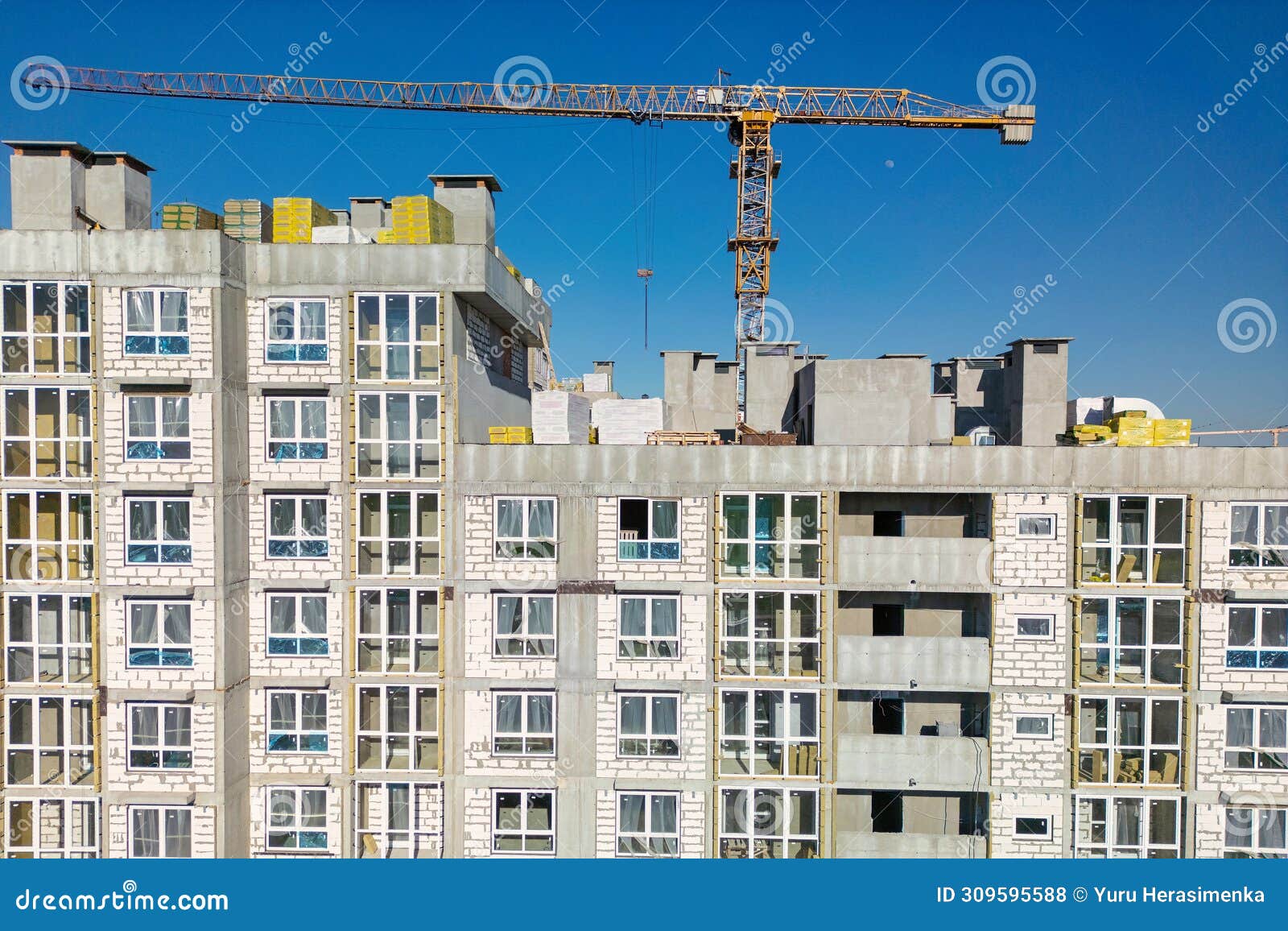 A Building Being Constructed with a Crane Positioned on Top, Showing ...