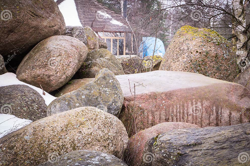 Building bihind stones stock image. Image of stones, roof - 88541285