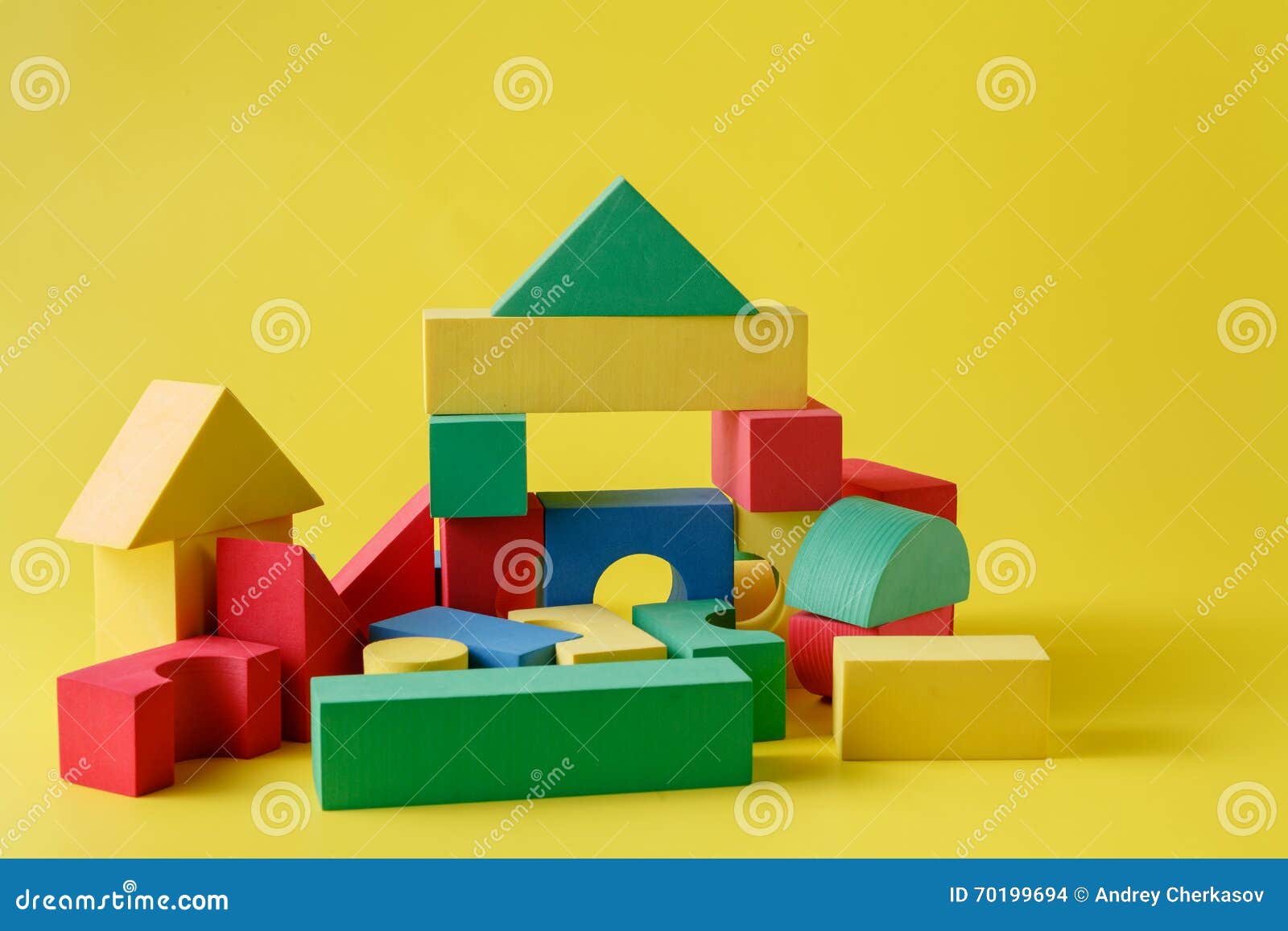 Building Blocks on Bright Yellow Background Stock Photo - Image of ...