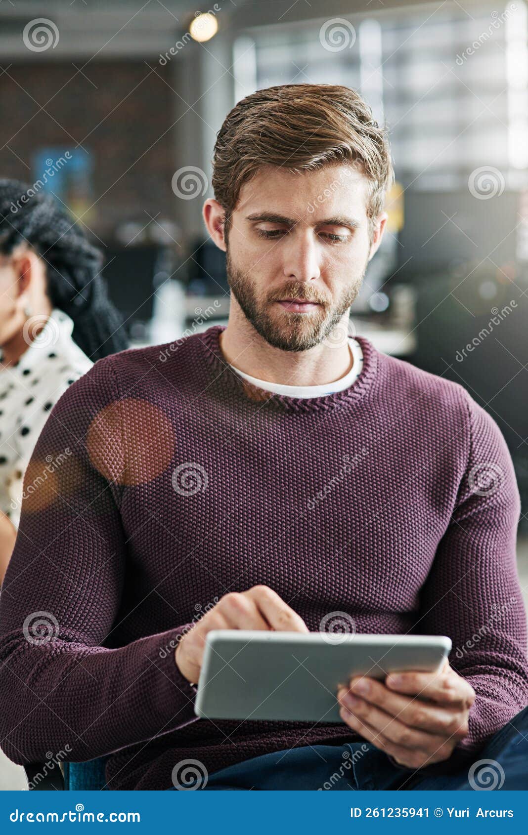 Building a Brand Using Online Tools. a Young Man Using a Digital Tablet ...