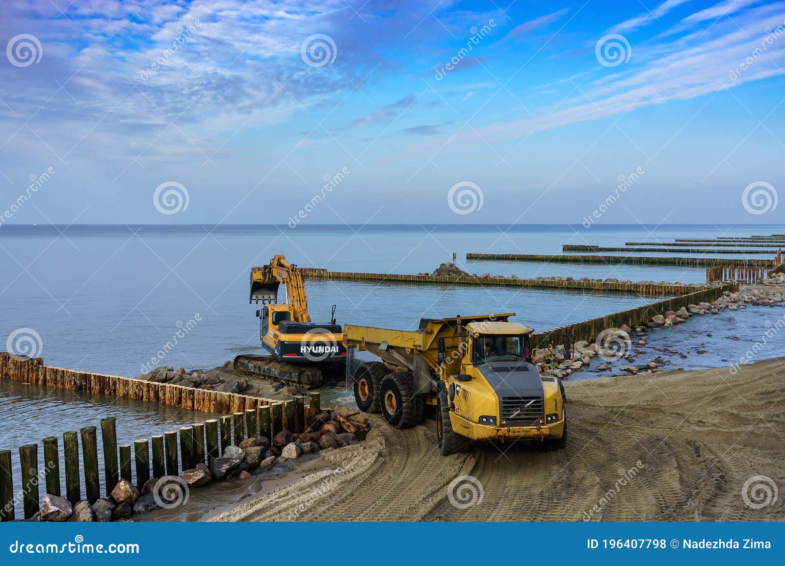 Building Breakwaters, Construction Equipment on the Seashore, Creating ...