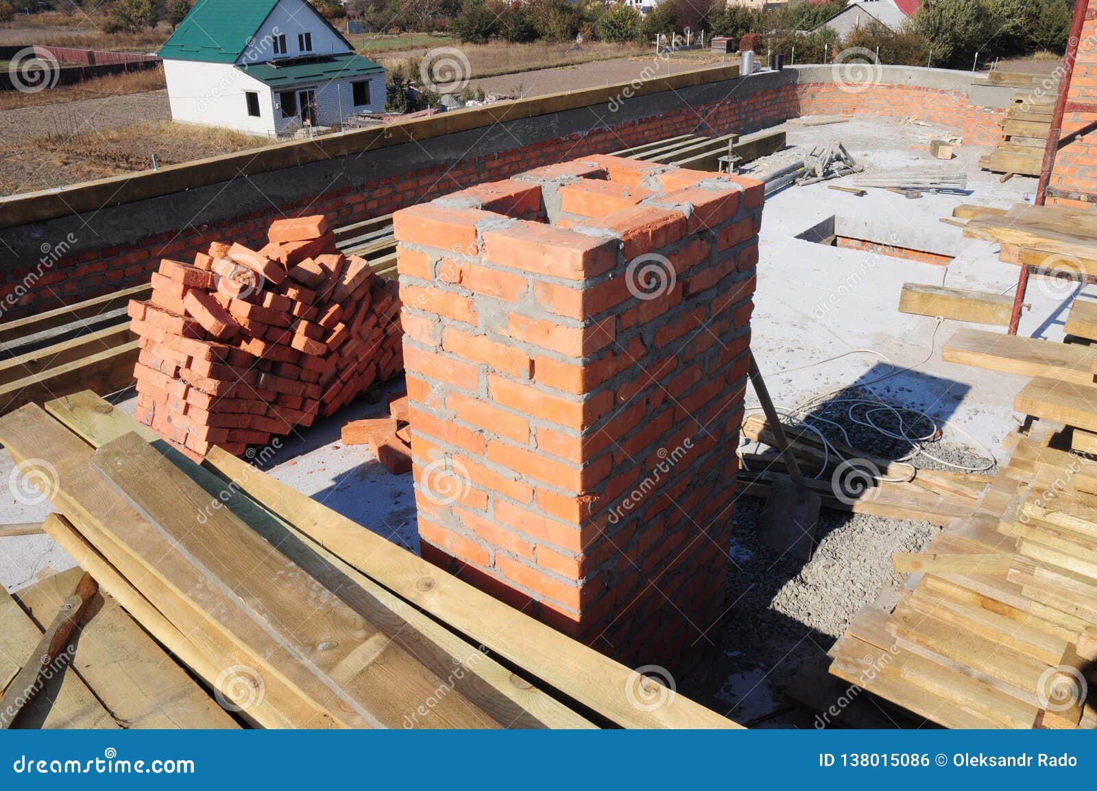 Building Chimney from Bricks. Bricklaying New House Chimney Stock Photo ...