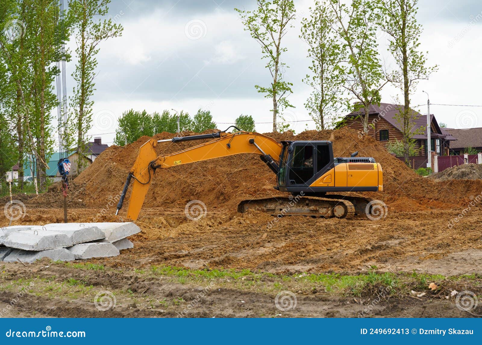 An Excavator is Digging a Pit for a House. Stock Image - Image of ...