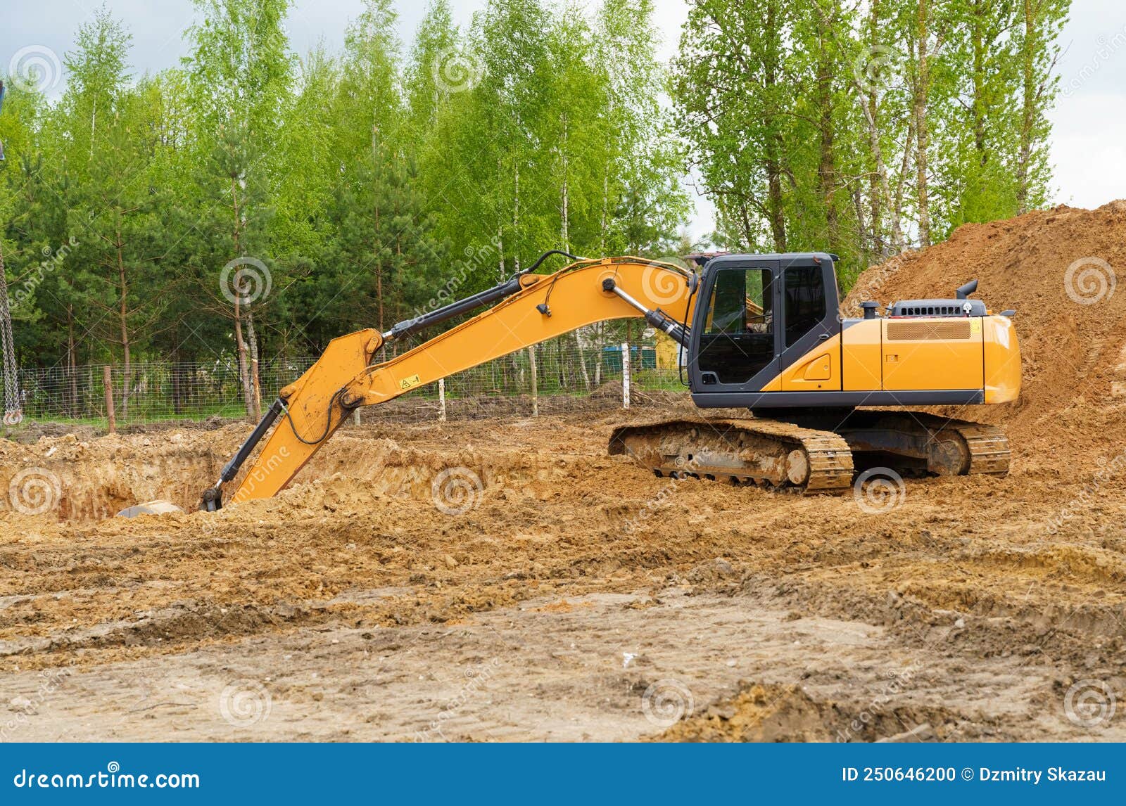 An Excavator is Digging a Pit for a House. Stock Photo - Image of ...