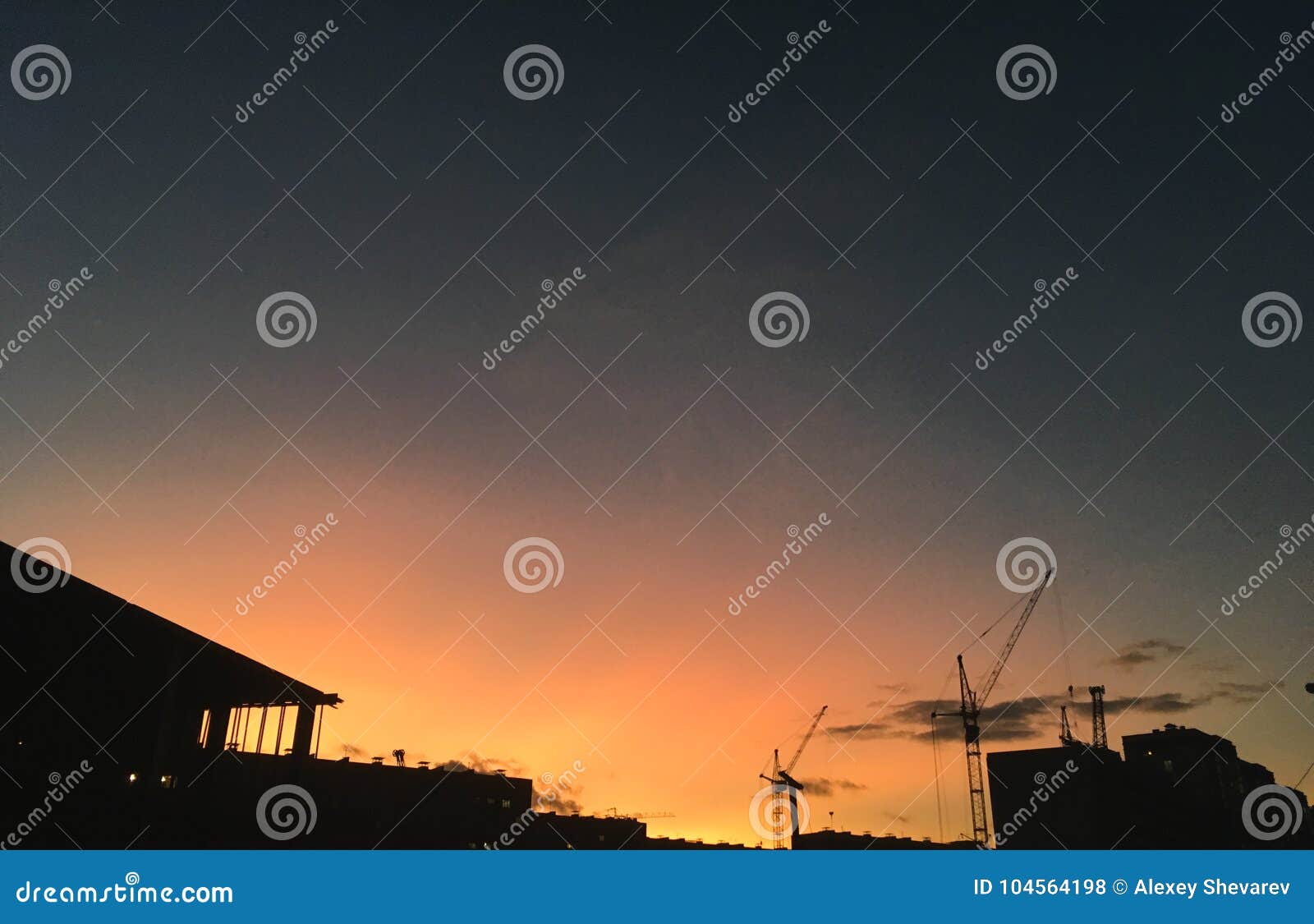 Building Construction on a Background of a Dark Sunset Sky Stock Photo ...