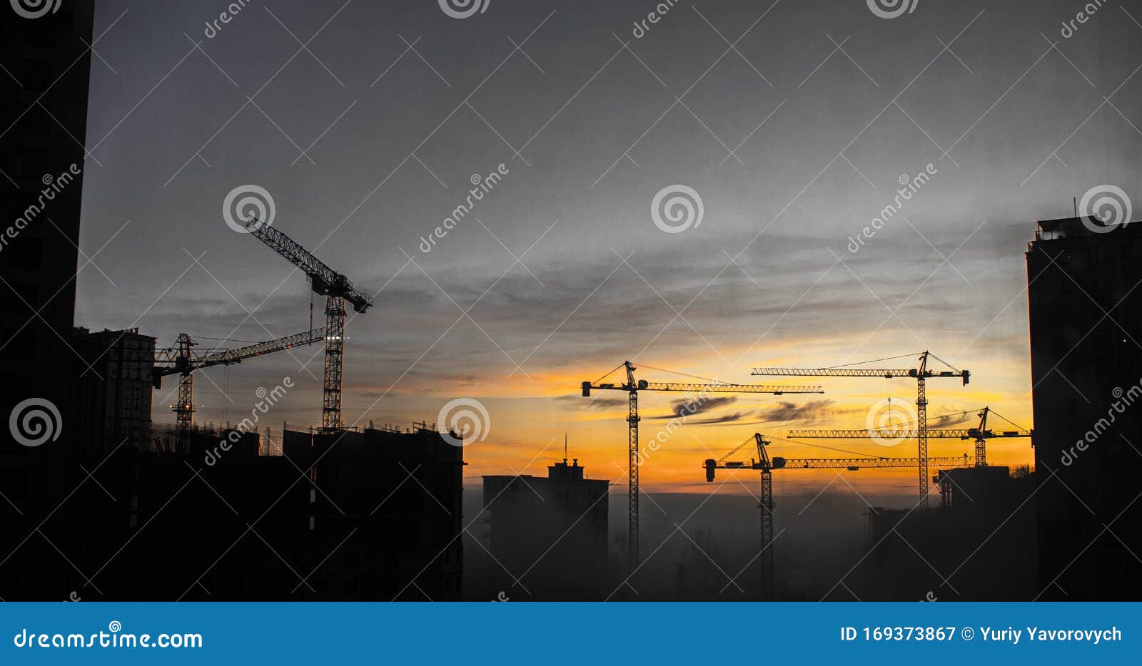 Building Construction with Cranes during Sunset. Cranes Building ...