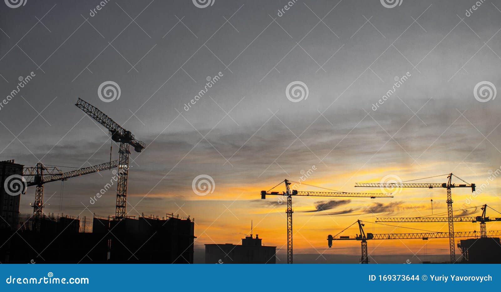 Building Construction with Cranes during Sunset. Cranes Building ...