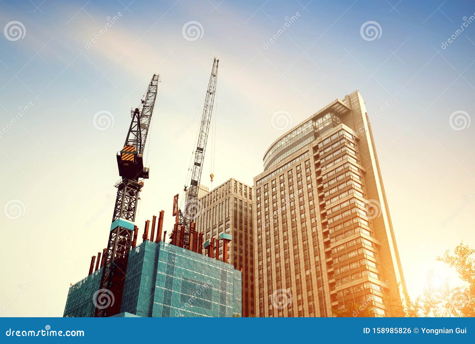Skyscraper Construction Site Stock Photo - Image of blue, crane: 158985826
