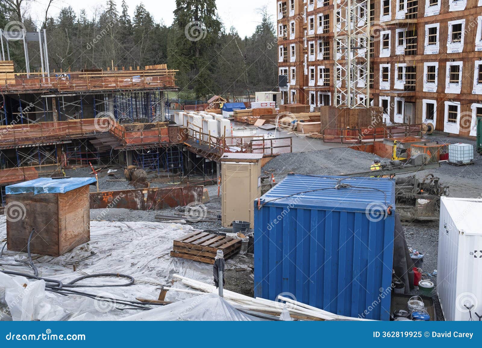 Construction Work Site Showing Two Buildings in Different Stages of ...