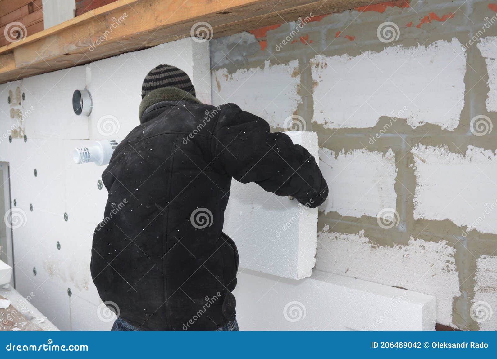 A Building Contractor is Installing an External Solid Wall Insulation ...