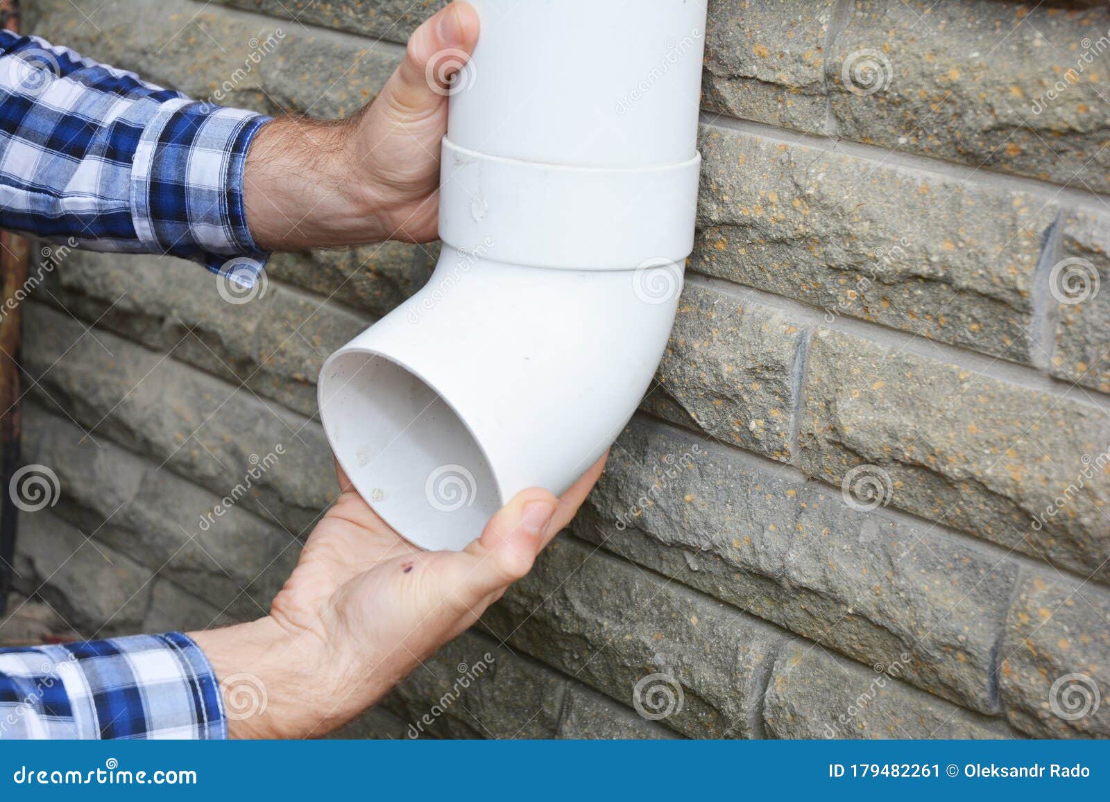 A Building Contractor is Installing New Rain Gutter System Attaching ...