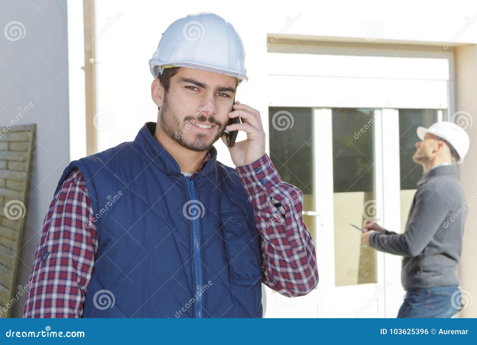 Building Contractor Working on Site Making Call Stock Photo - Image of ...