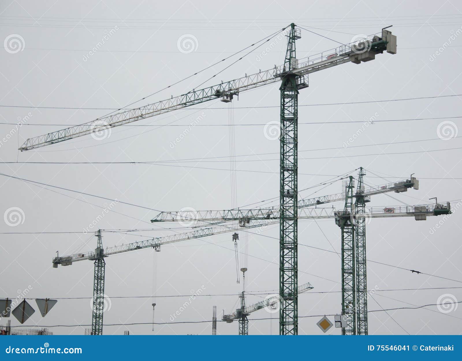 Building Cranes At Front Of A Multi-storey Uilding Under Construction ...