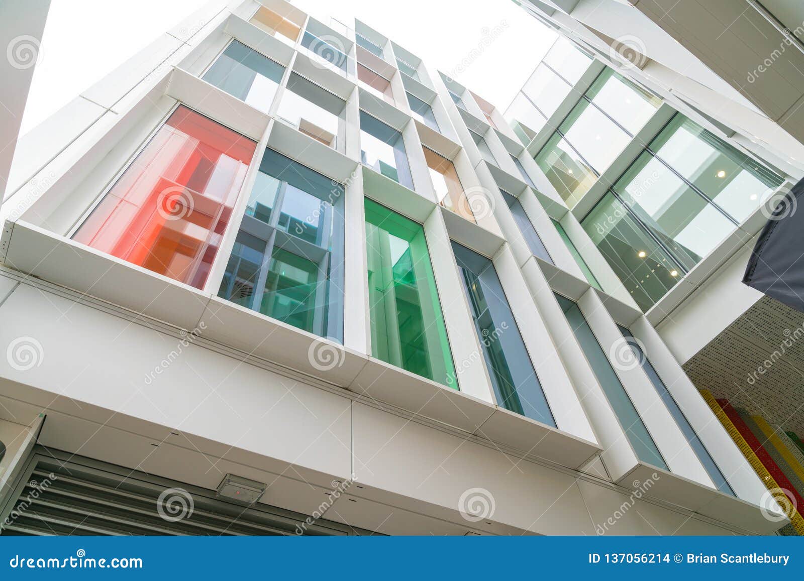 Building Facade with Multi-colored Glass Windows Stock Photo - Image of ...