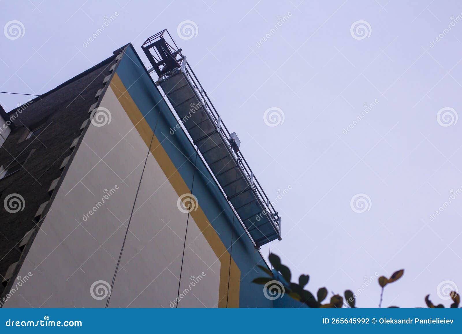 Building Facade Renovation. the Construction Cradle is Suspended for ...