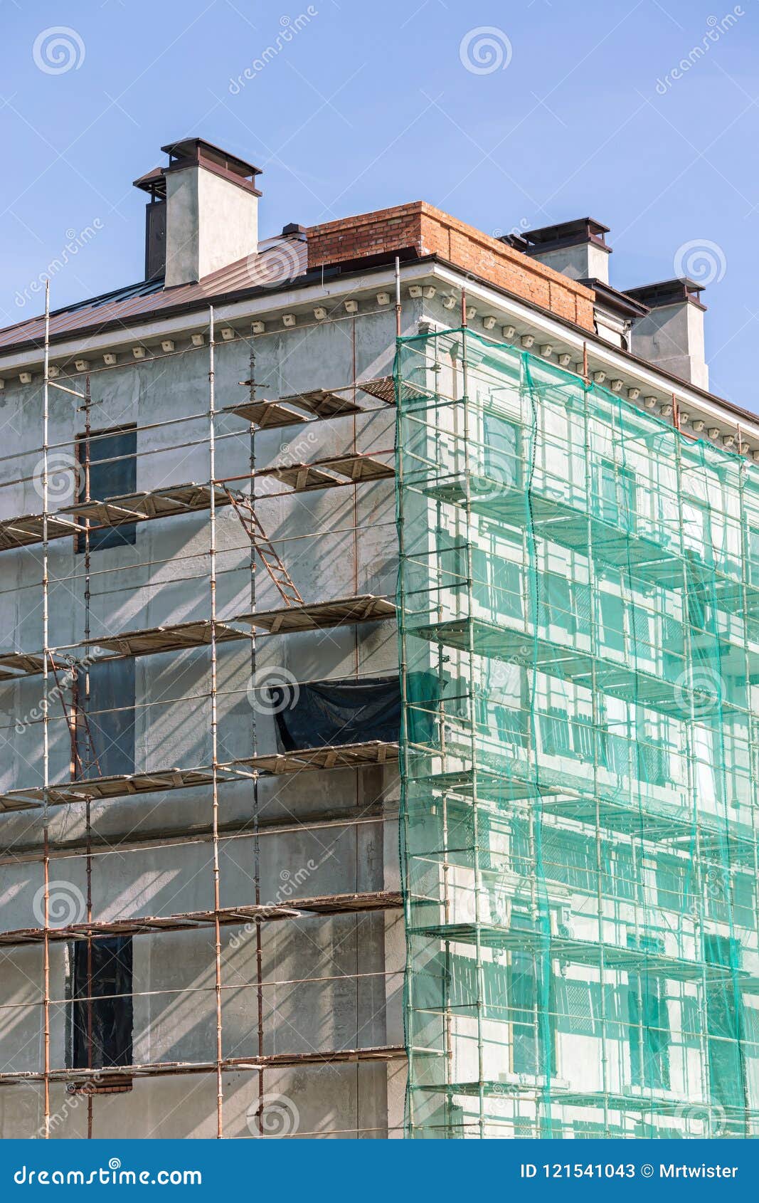 Building Facade with Scaffolding and Protective Mesh Stock Image ...