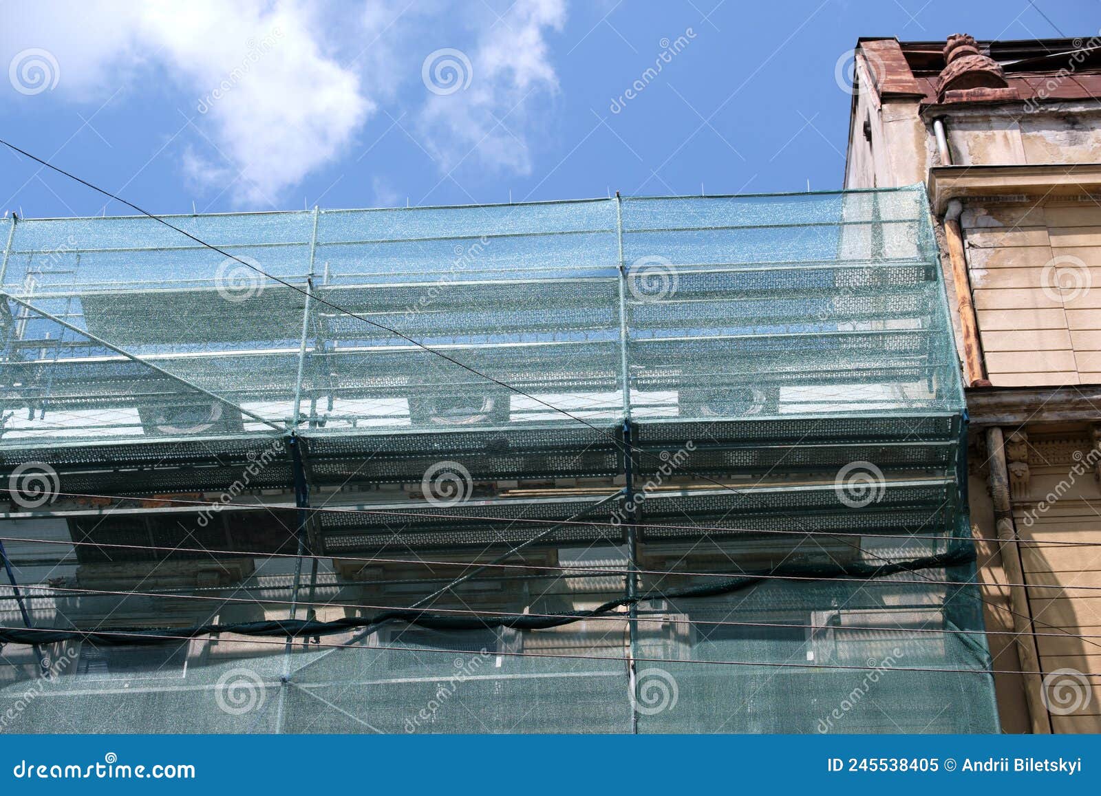 Building Facade Under Renovation Works with Construction Scaffolding ...