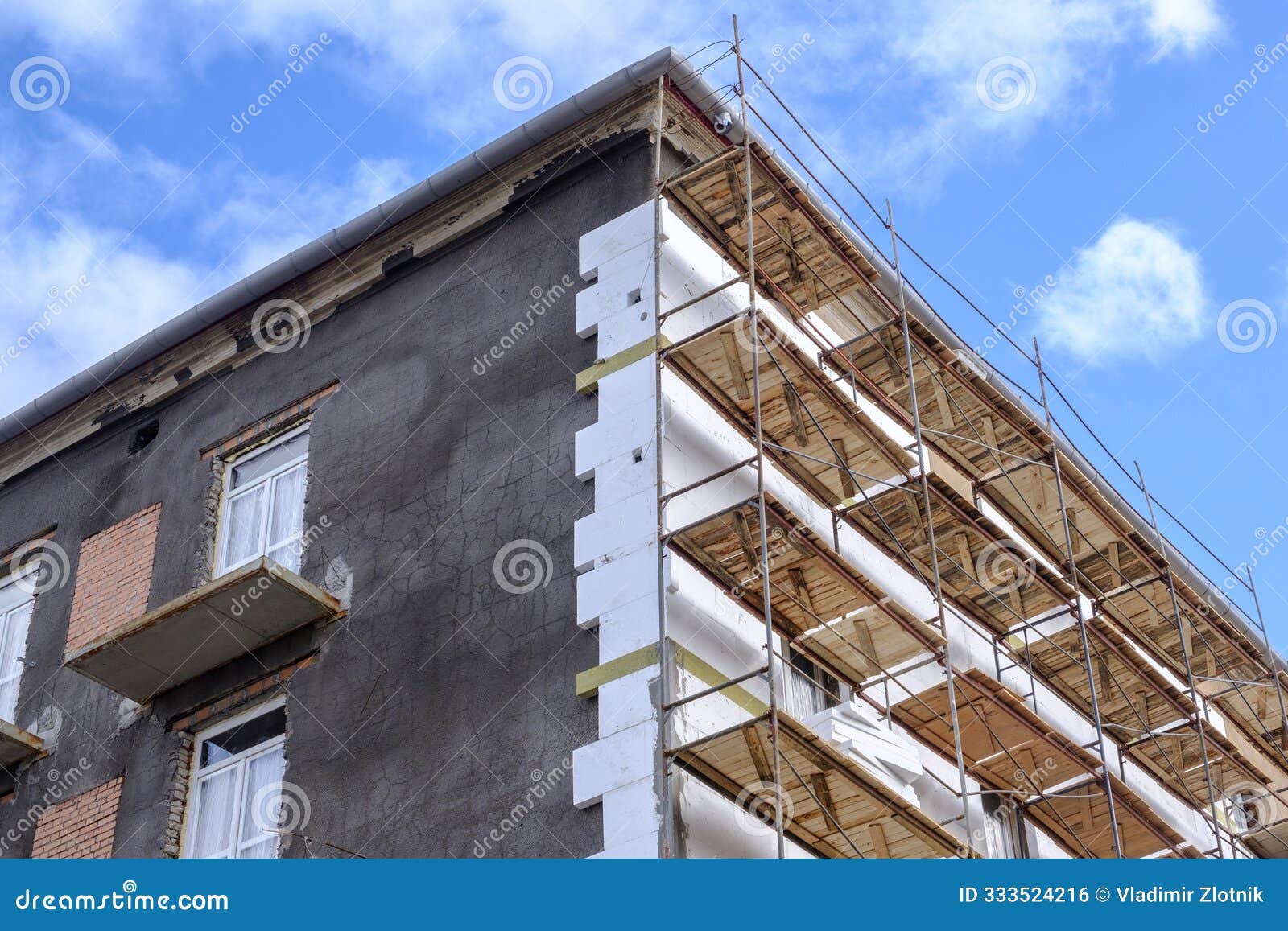Building Facade Under Renovation Works with Construction Scaffolding ...