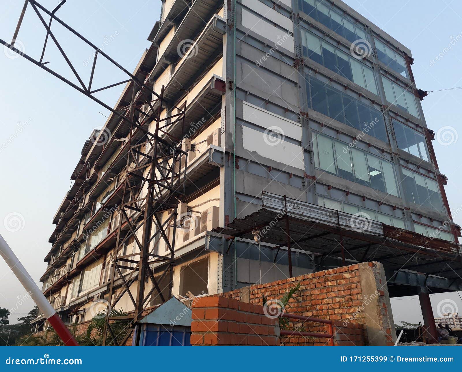 Construction In Progress. Concrete Wall And The Crane Stock Photo ...
