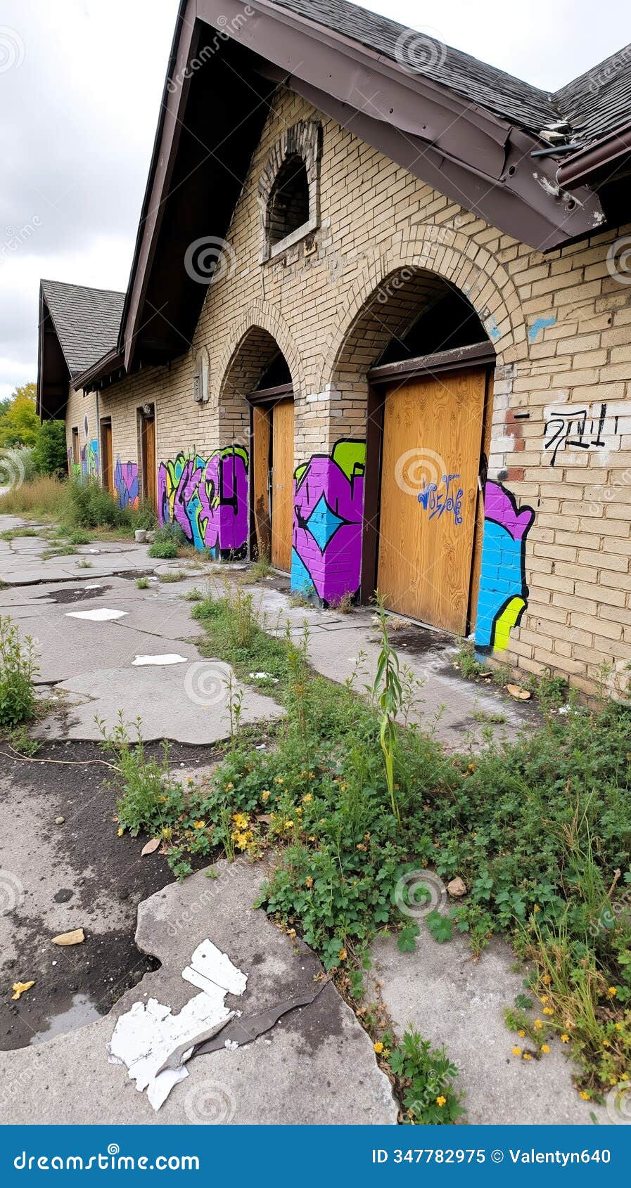 A Building with Graffiti on the Side of it Stock Image - Image of ...