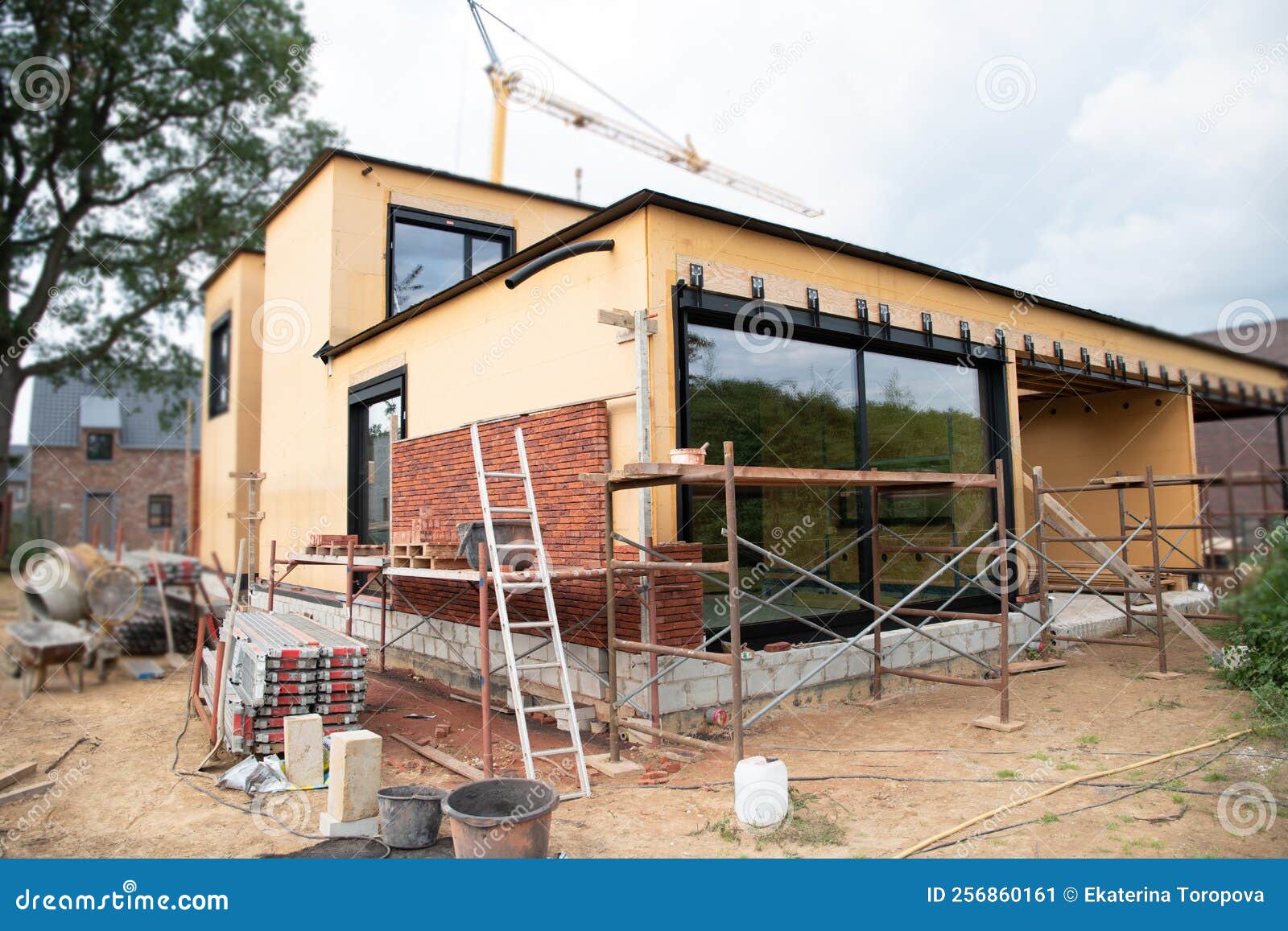 Building a House Supporting Structure for Laying Bricks Around a Wooden ...
