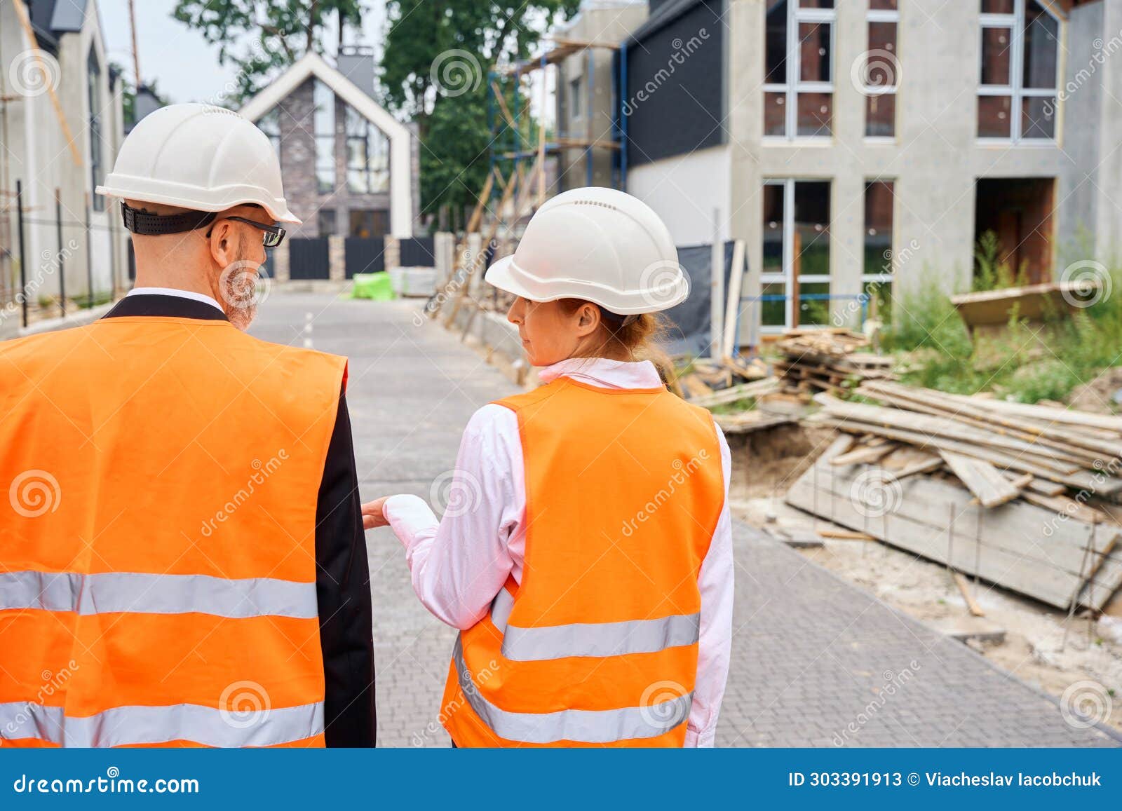 Building Inspector Talking To Contractor during Development Site ...