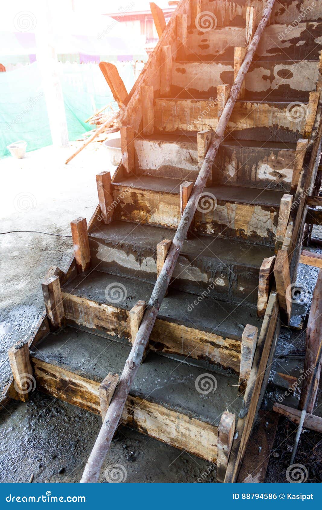 A Man Is Building A Ladder Or Growth Chart From Blocks. Strategy ...