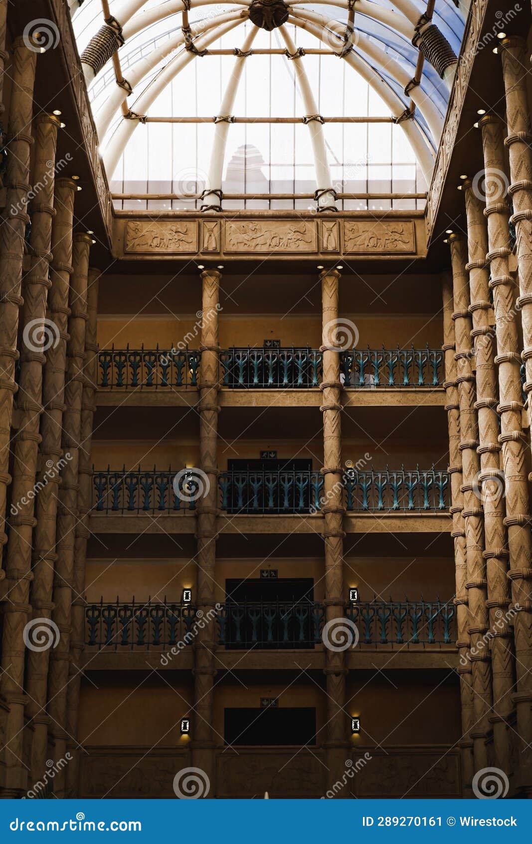 A Building with a Large Atrium is Shown with Columns and a Dome Ceiling ...