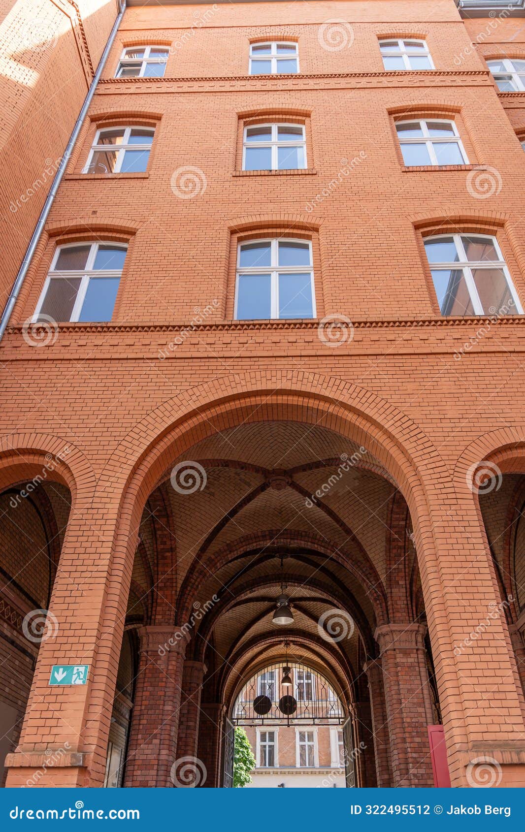 The Building is a Large Brick Building with Arched Windows Stock Photo ...